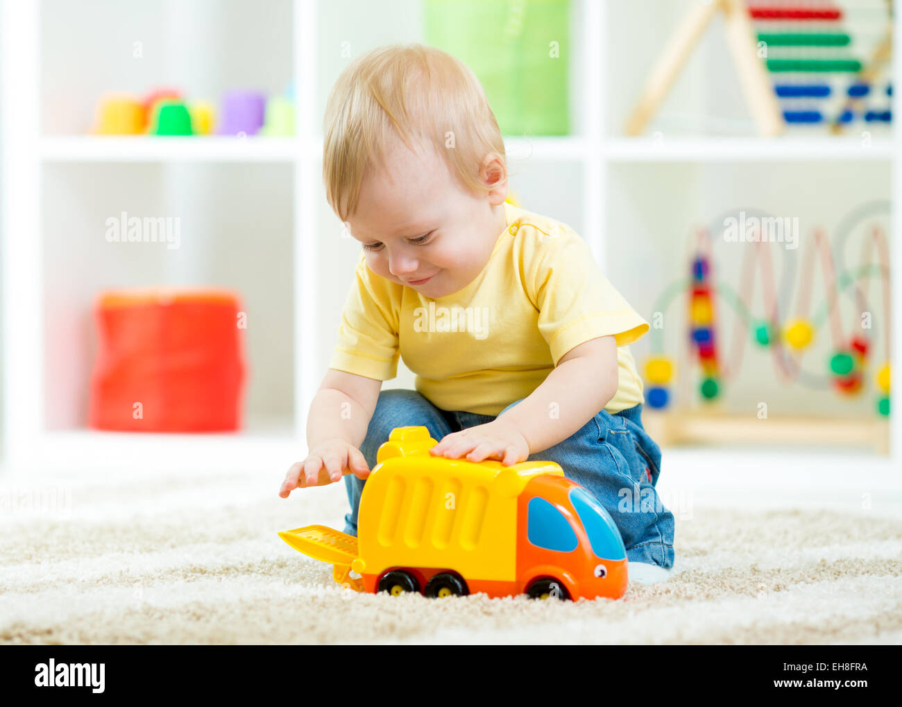 kid boy toddler playing with toy car Stock Photo - Alamy