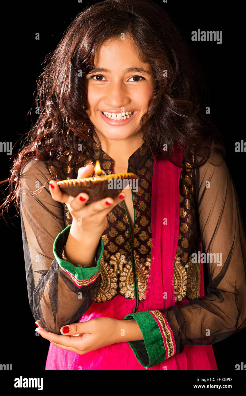 1 indian Young girl Teenager diwali holding Diya Worship Stock Photo ...