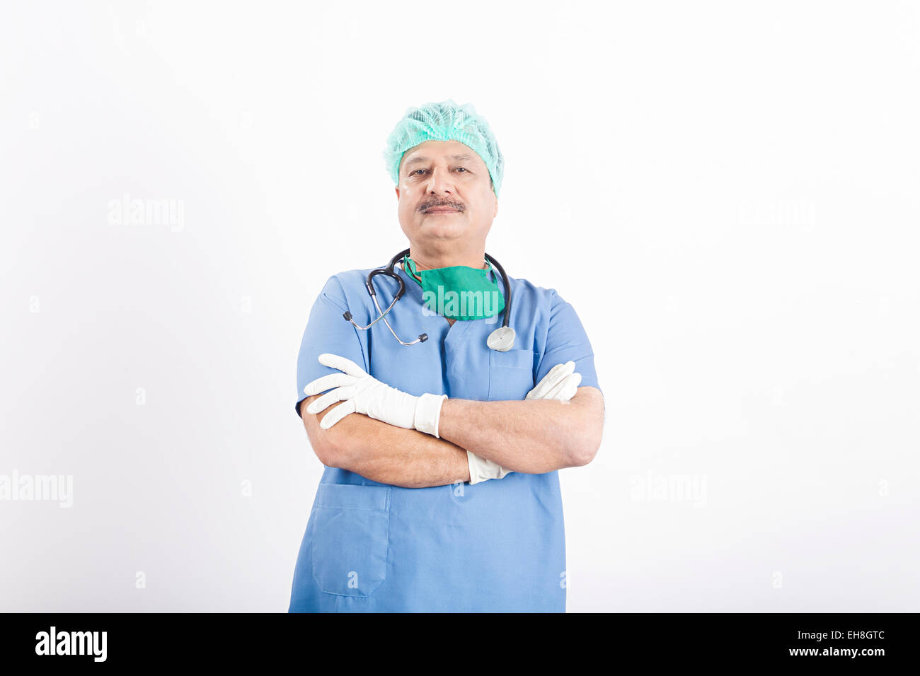1 indian Senior Adult Man Surgeon doctor standing pose Stock Photo - Alamy