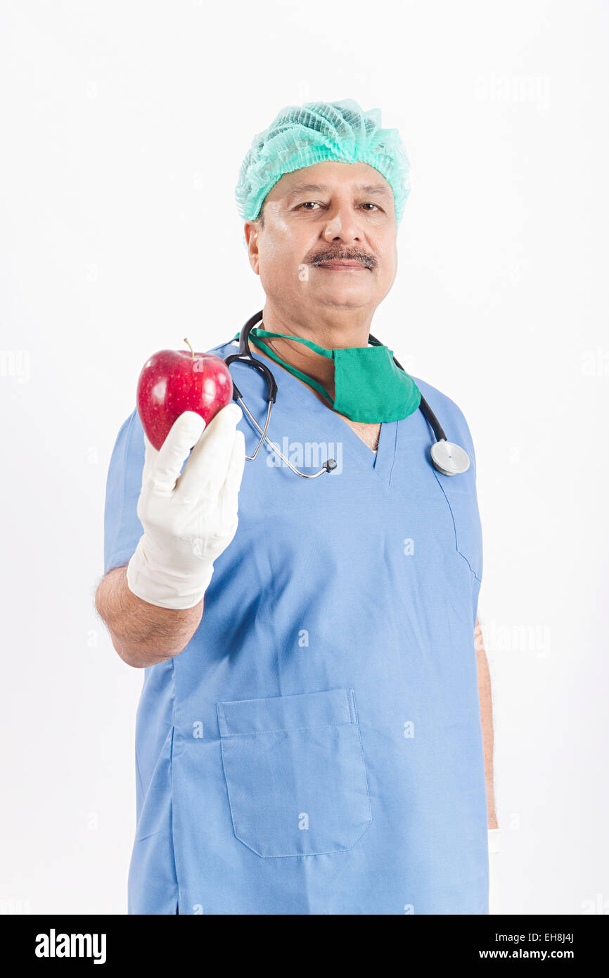 1 indian Senior Adult Man Senior doctor Apple Showing Stock Photo - Alamy