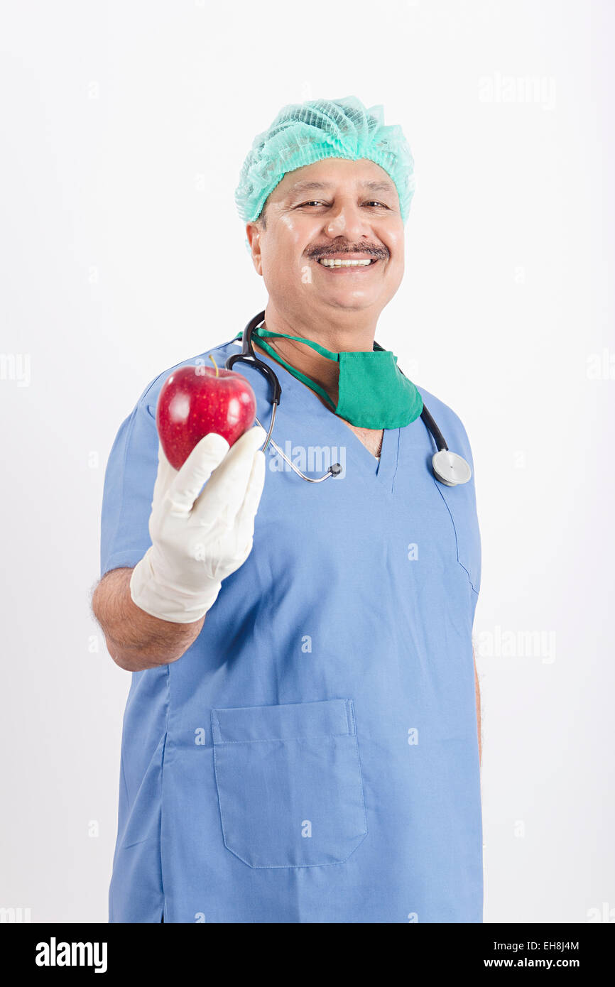 1 indian Senior Adult Man Surgeon doctor Apple Showing Stock Photo - Alamy