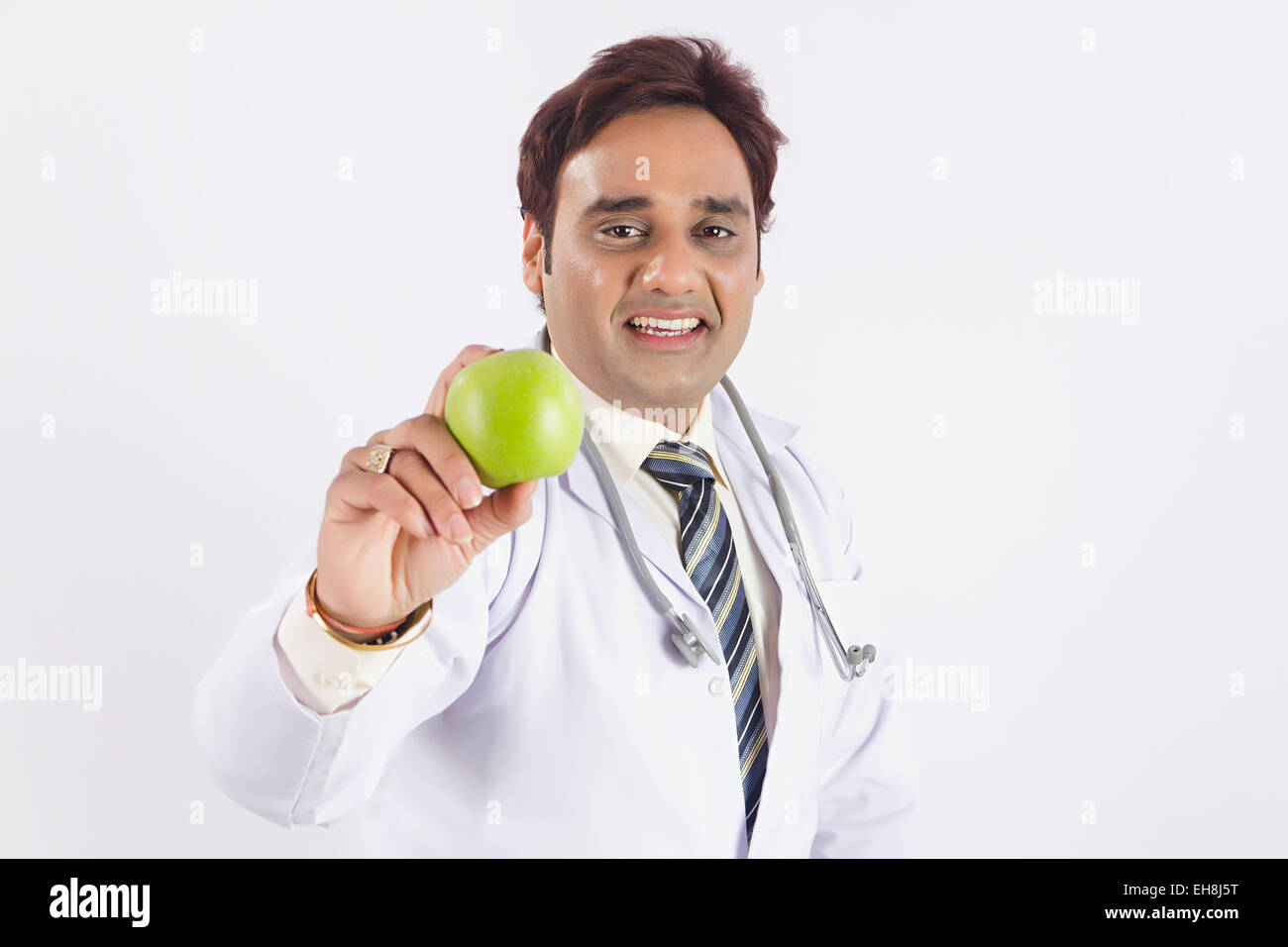 1 indian Adult Man doctor Apple Showing Stock Photo - Alamy