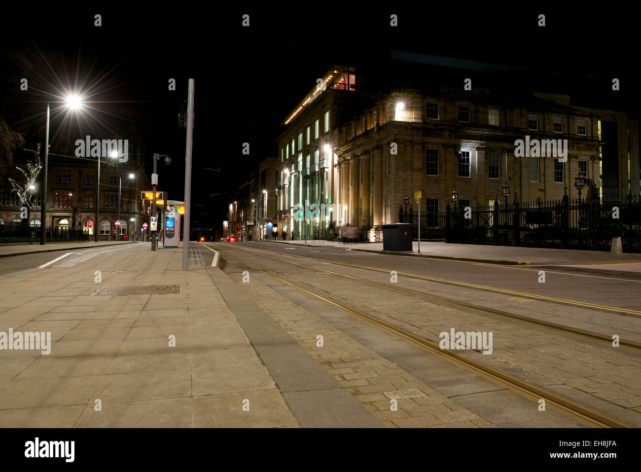 Tram platform on St. Andrew Square, Edinburgh with Harvey Nichols store ...