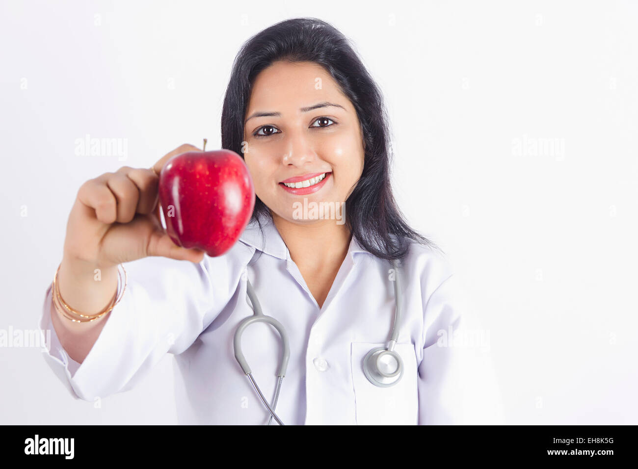 1 indian Adult woman doctor Apple Showing Stock Photo - Alamy