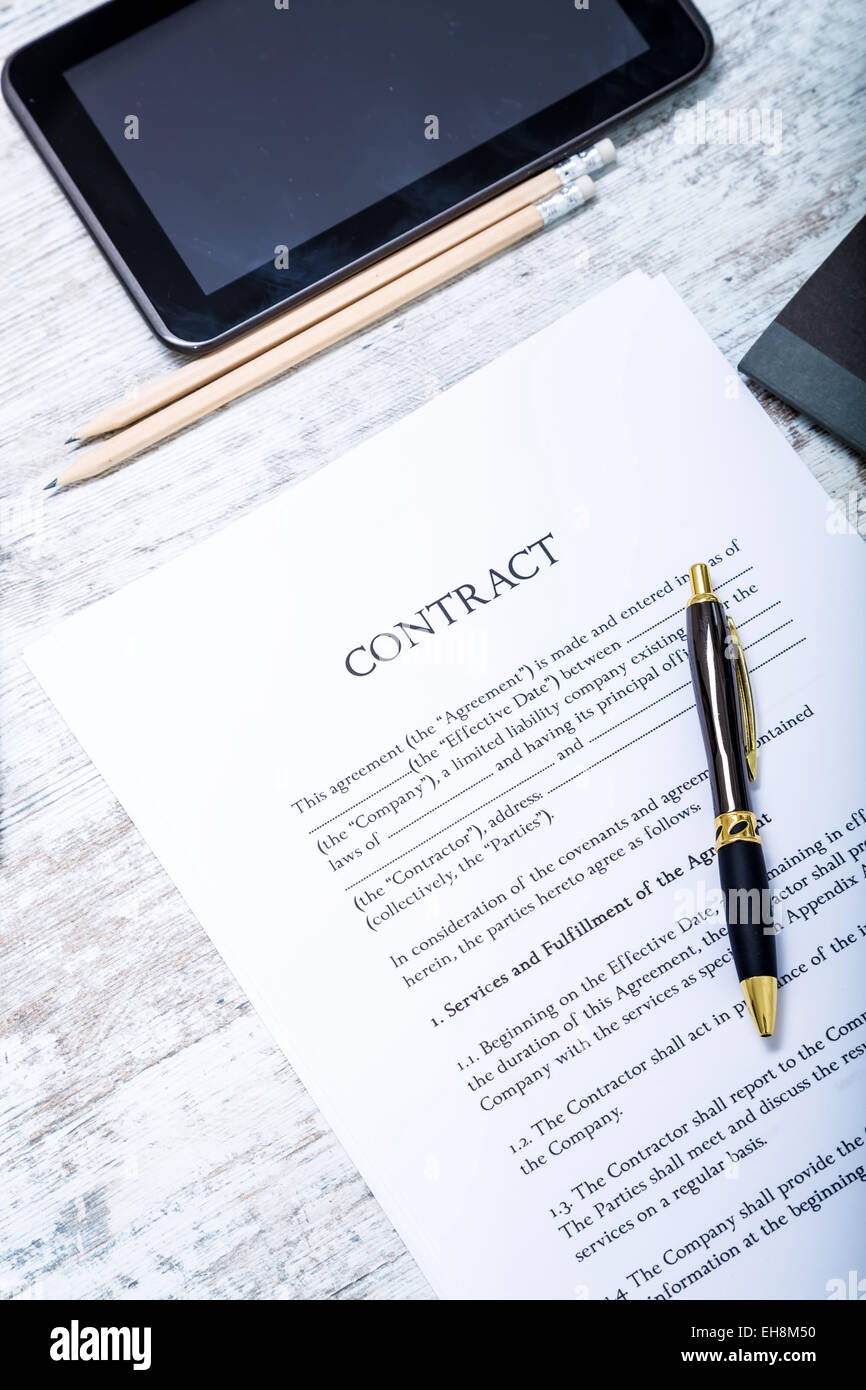 Reading a Contract before signing Stock Photo - Alamy