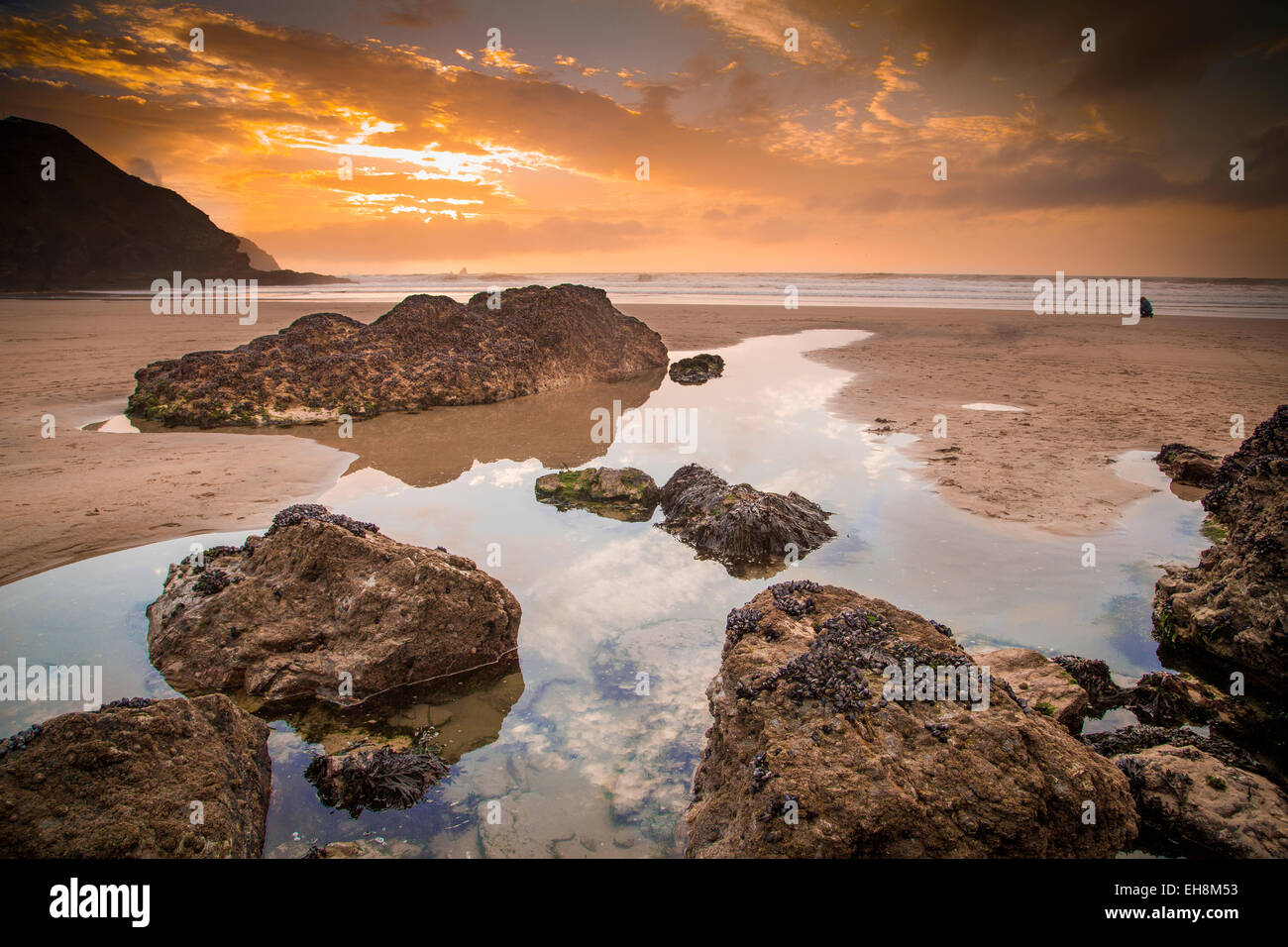 Sunset over a Cornish beach Stock Photo - Alamy