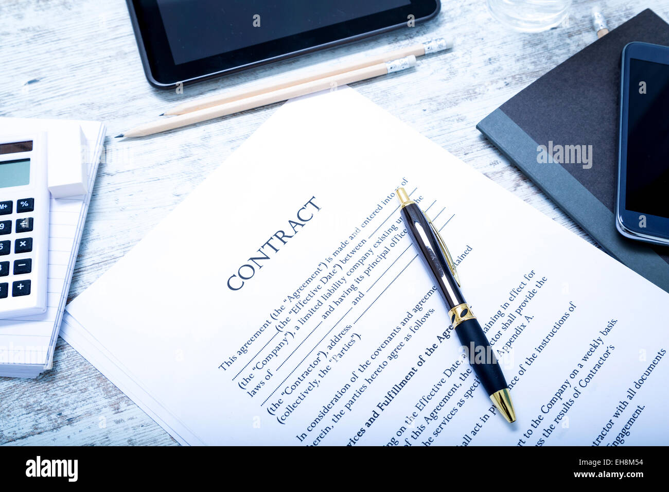 Reading a Contract before signing Stock Photo - Alamy