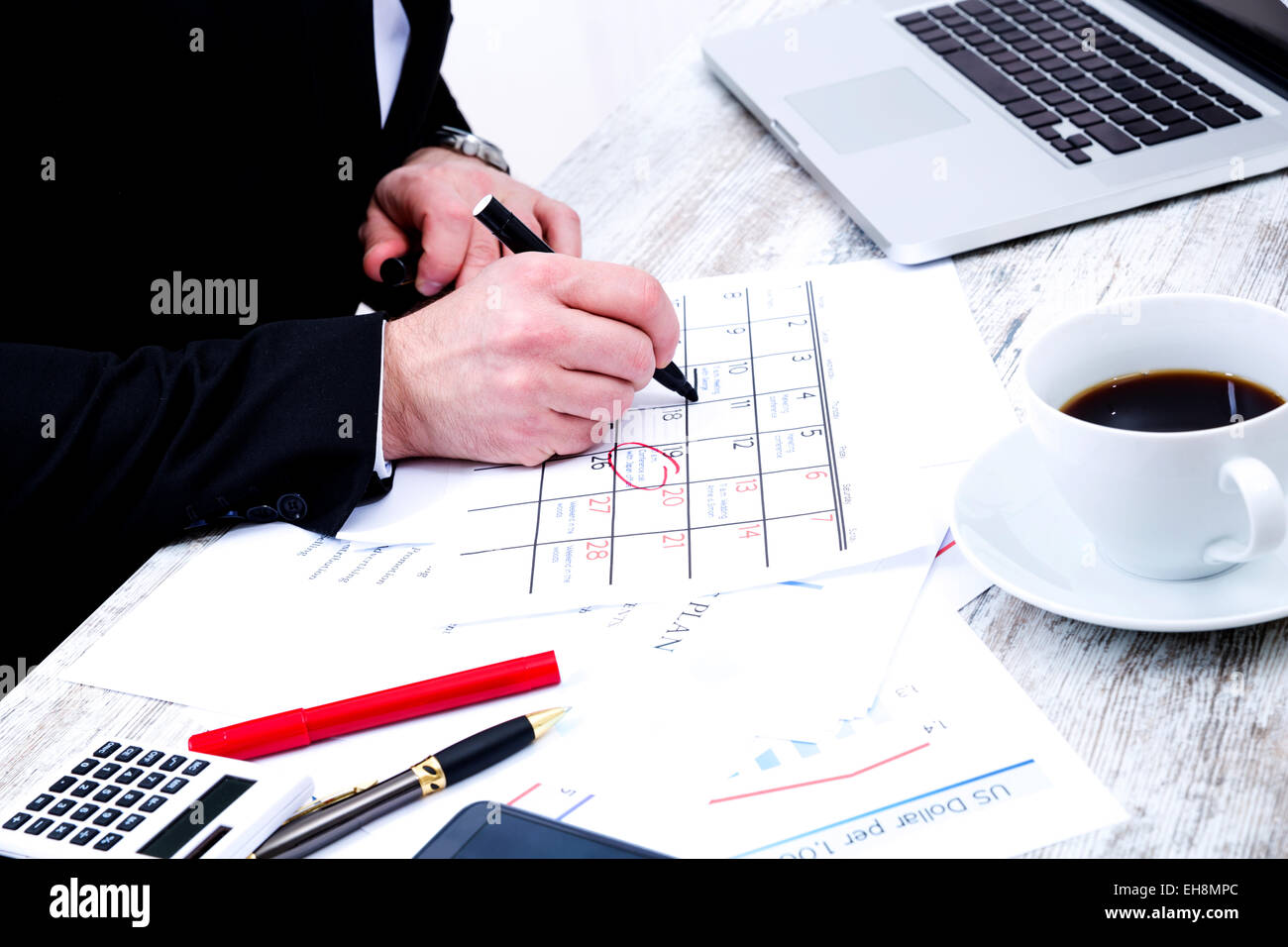 Businessman checking appointments in the calendar at the office Stock ...