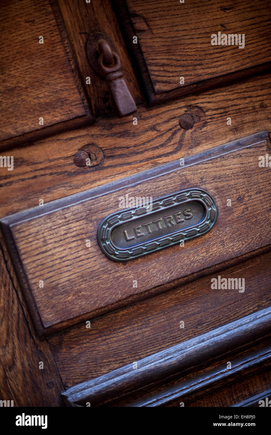Vintage French letter box on a wooden door Stock Photo - Alamy