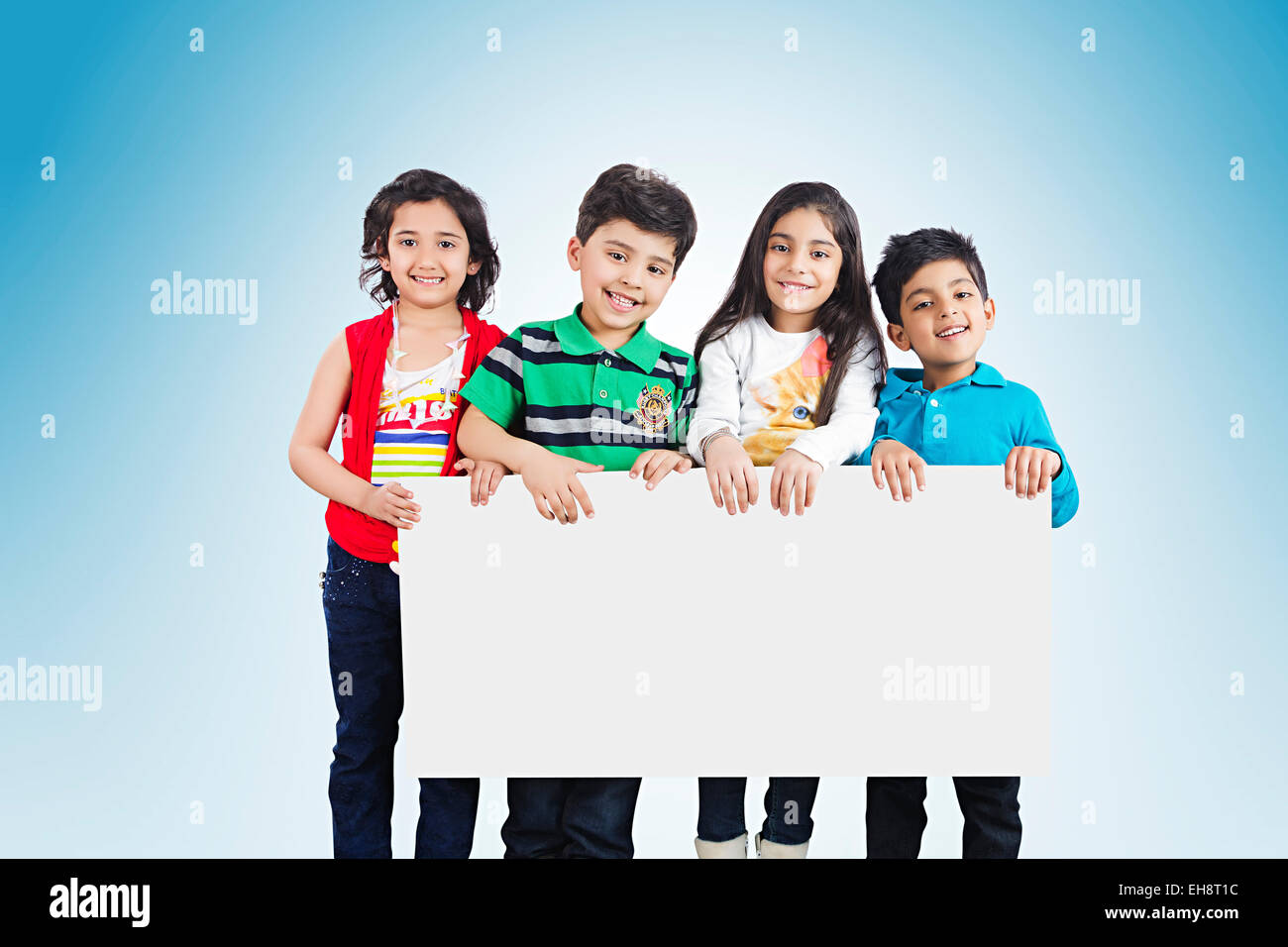 4 indian kids Friends Message Board showing Stock Photo - Alamy