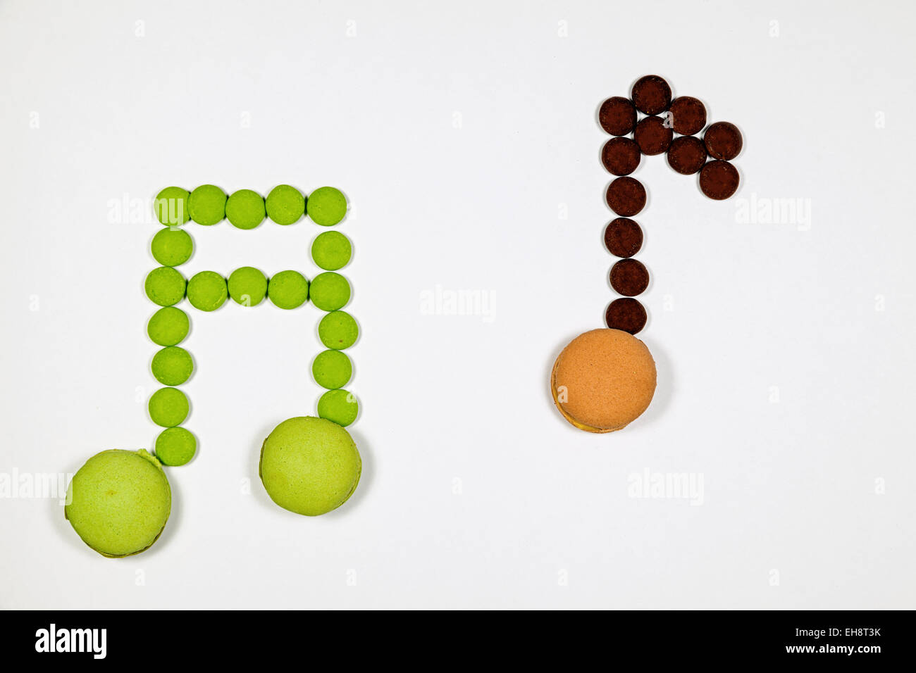 Musical note made chocolate candy and macaron Stock Photo - Alamy