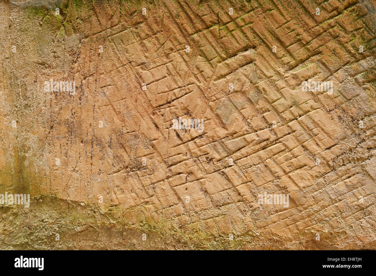 Keyed and scratched surface of stone with marks as a key to take a ...