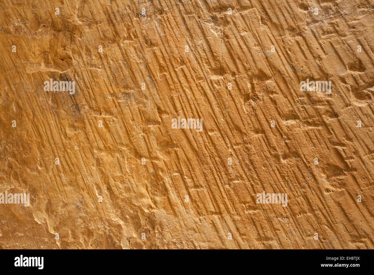 Keyed and scratched surface of stone with marks as a key to take a ...