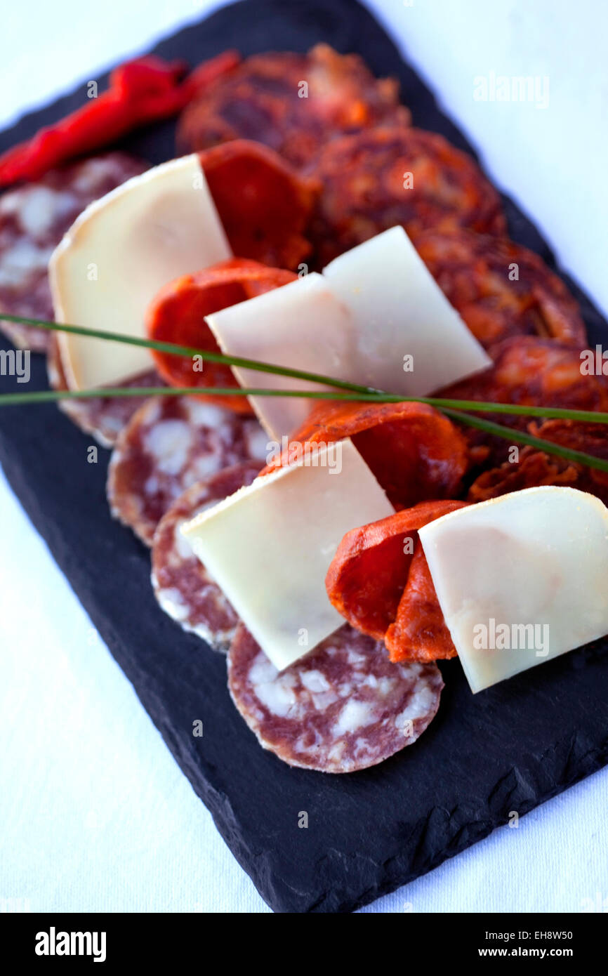 Plate with sausage, chorizo and cheese in a Spanish restaurant Stock ...