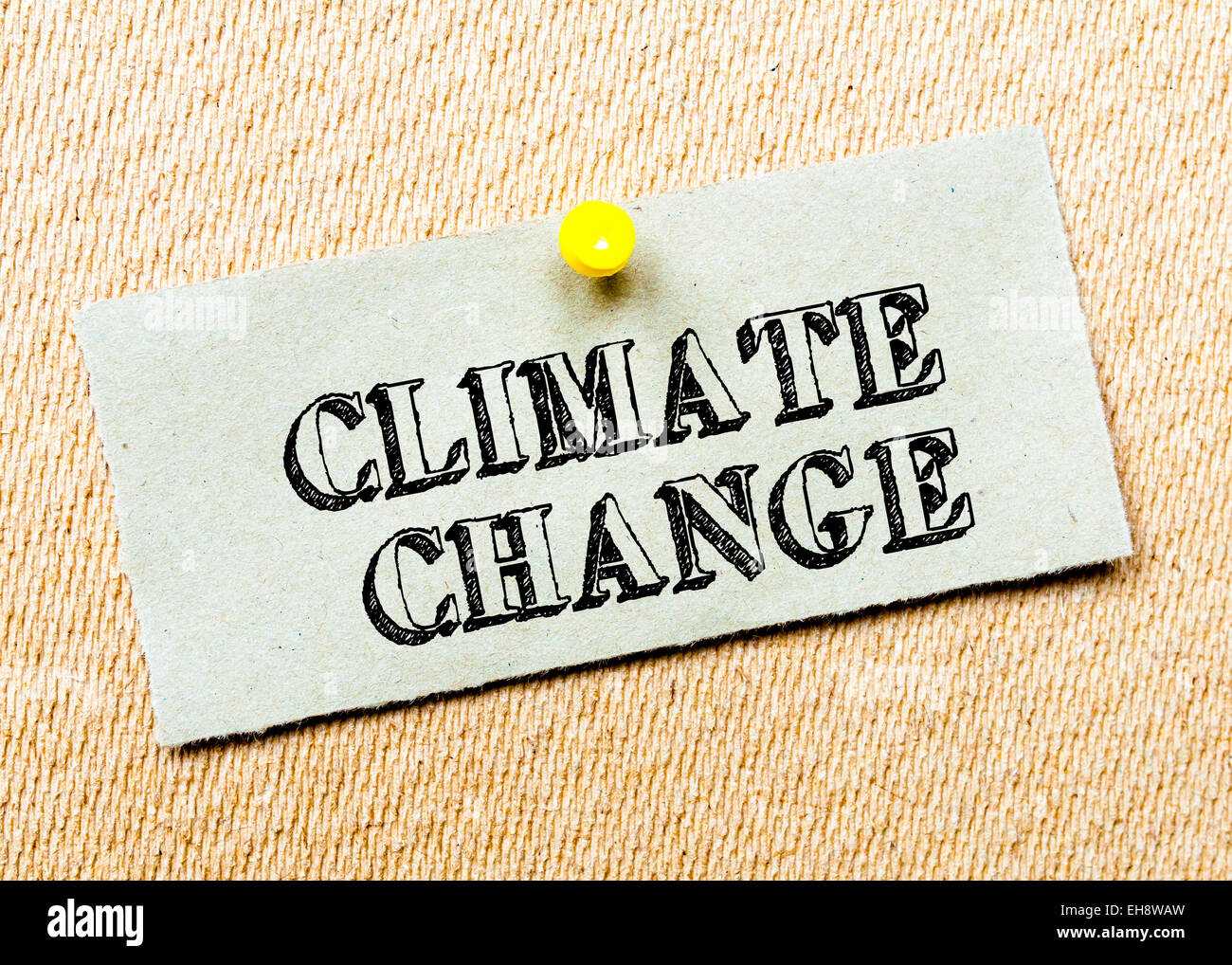 Recycled paper note pinned on cork board. Climate Change Message ...