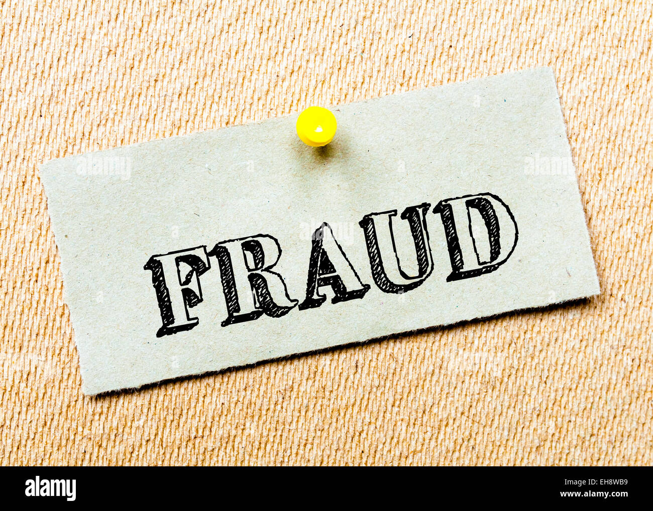 Recycled paper note pinned on cork board. Fraud Message. Concept Image ...