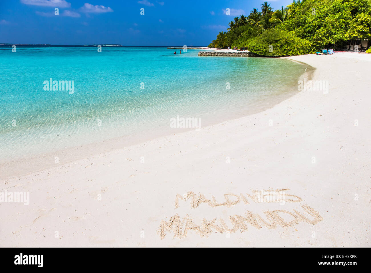 A view of the beach at Makunudu Island in the Maldives with writing in ...
