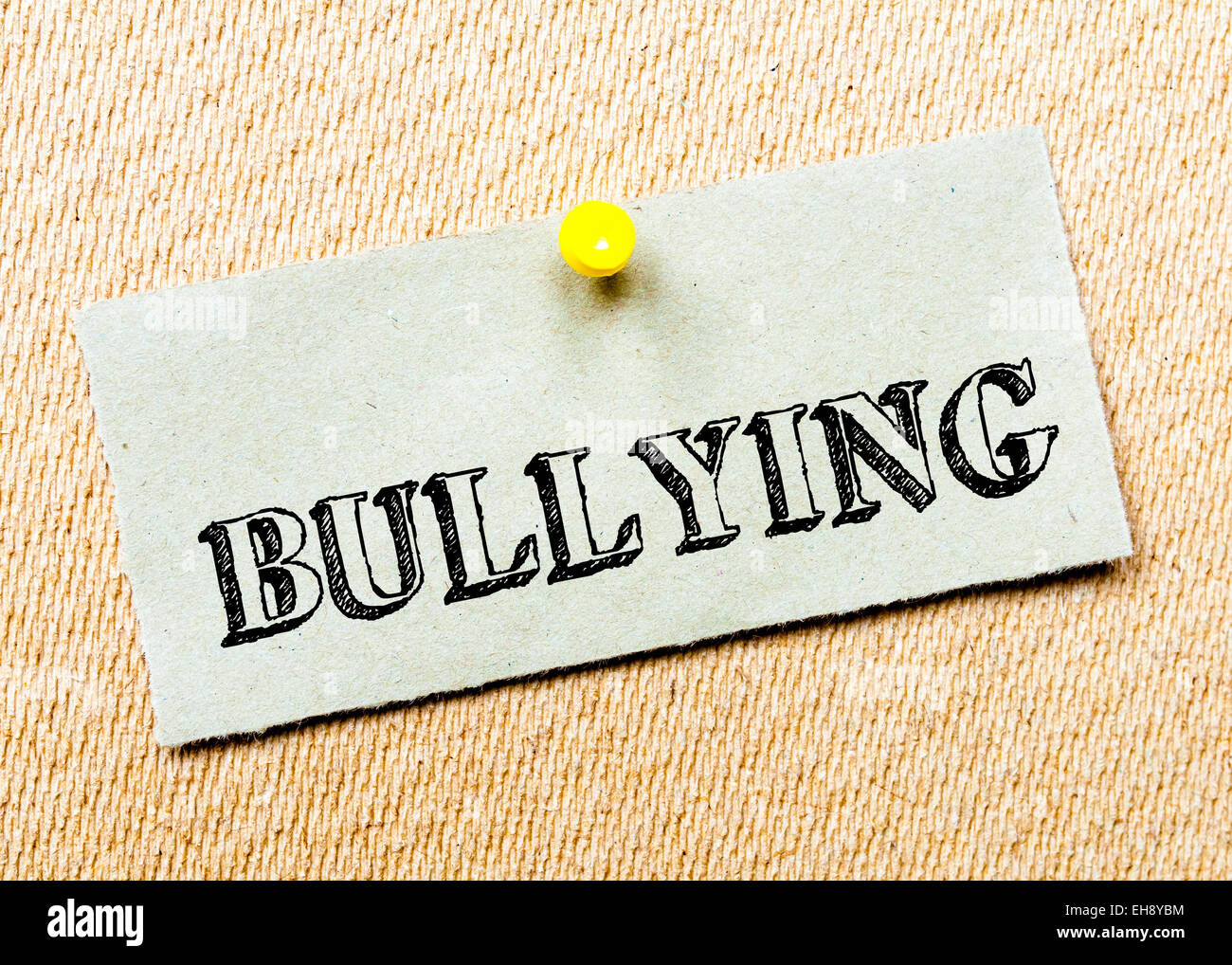 Recycled paper note pinned on cork board. Bullying Message. Concept ...