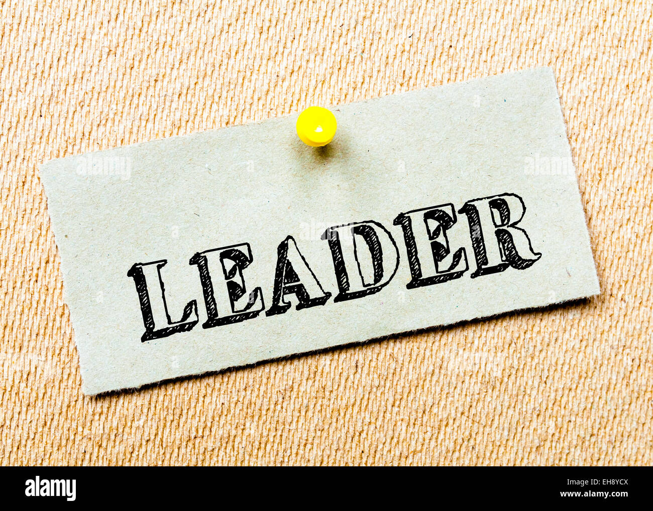 Recycled paper note pinned on cork board. Leader Message. Concept Image ...