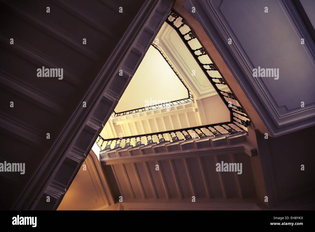 Abstract interior fragment, triangle shaped flight of stairs, looking ...