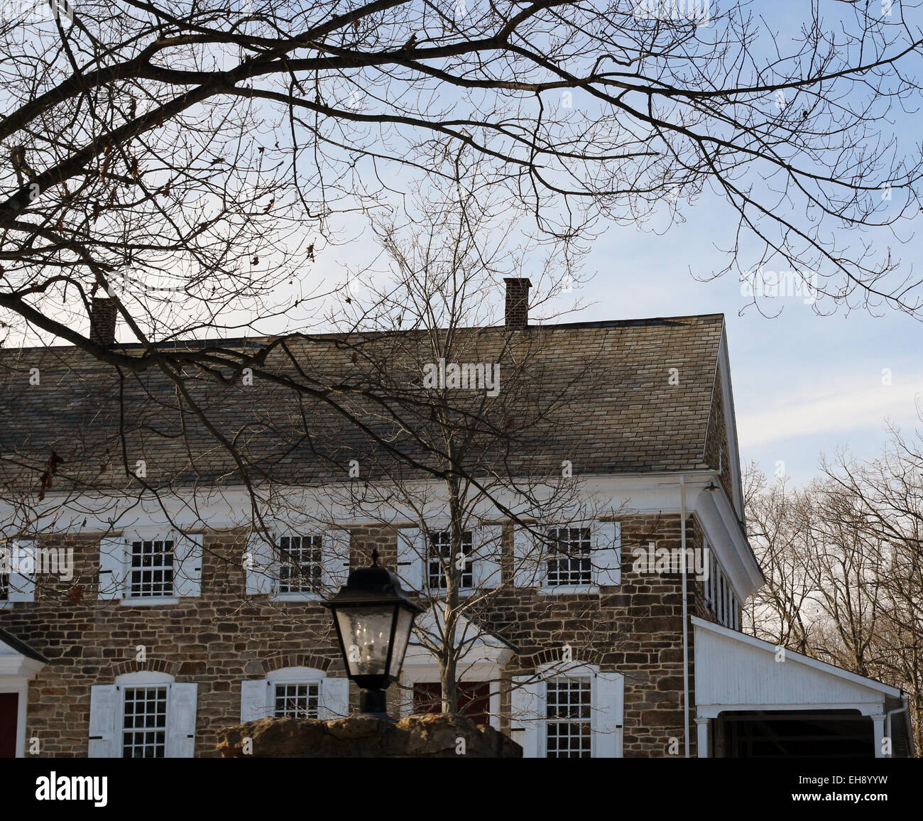 Old vintage historic two story colonial stone house Stock Photo - Alamy