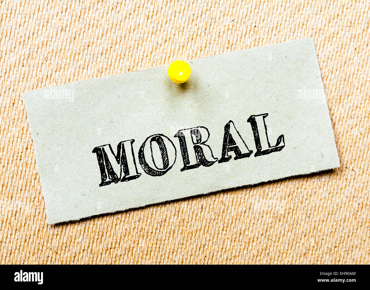 Recycled paper note pinned on cork board. Moral Message. Concept Image ...