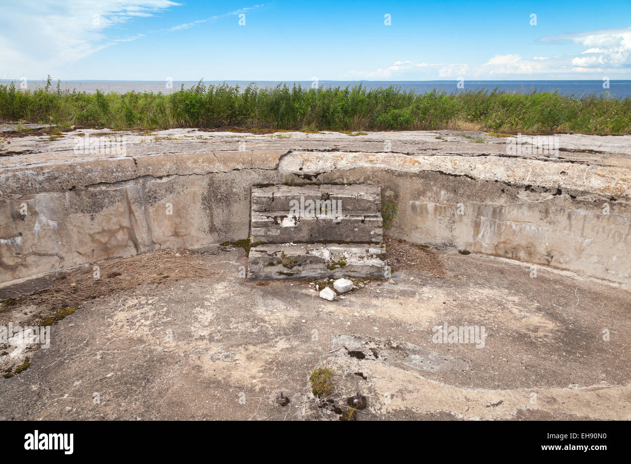 Empty round open air concrete interior of abandoned gun base from WWII ...