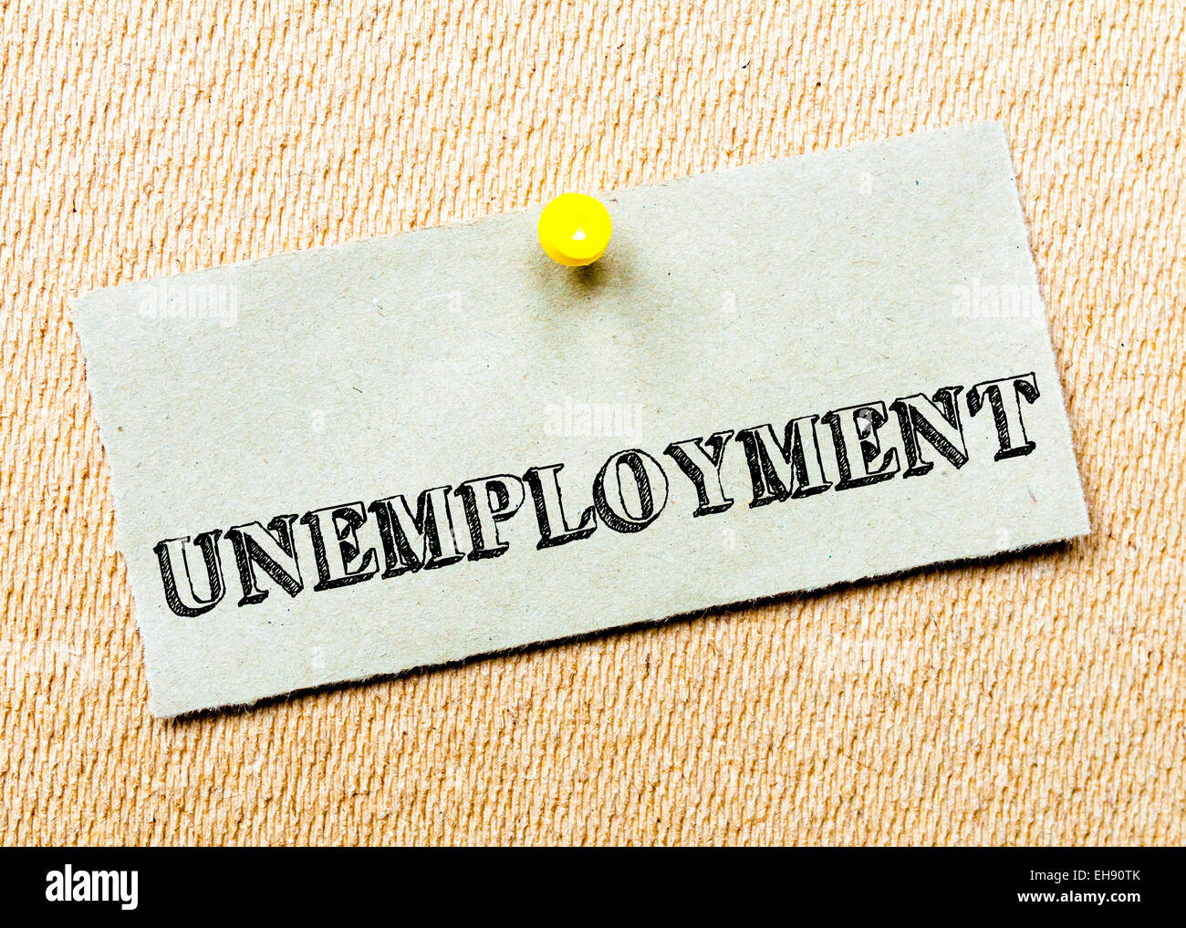 Recycled paper note pinned on cork board.Unemployment Message. Concept ...
