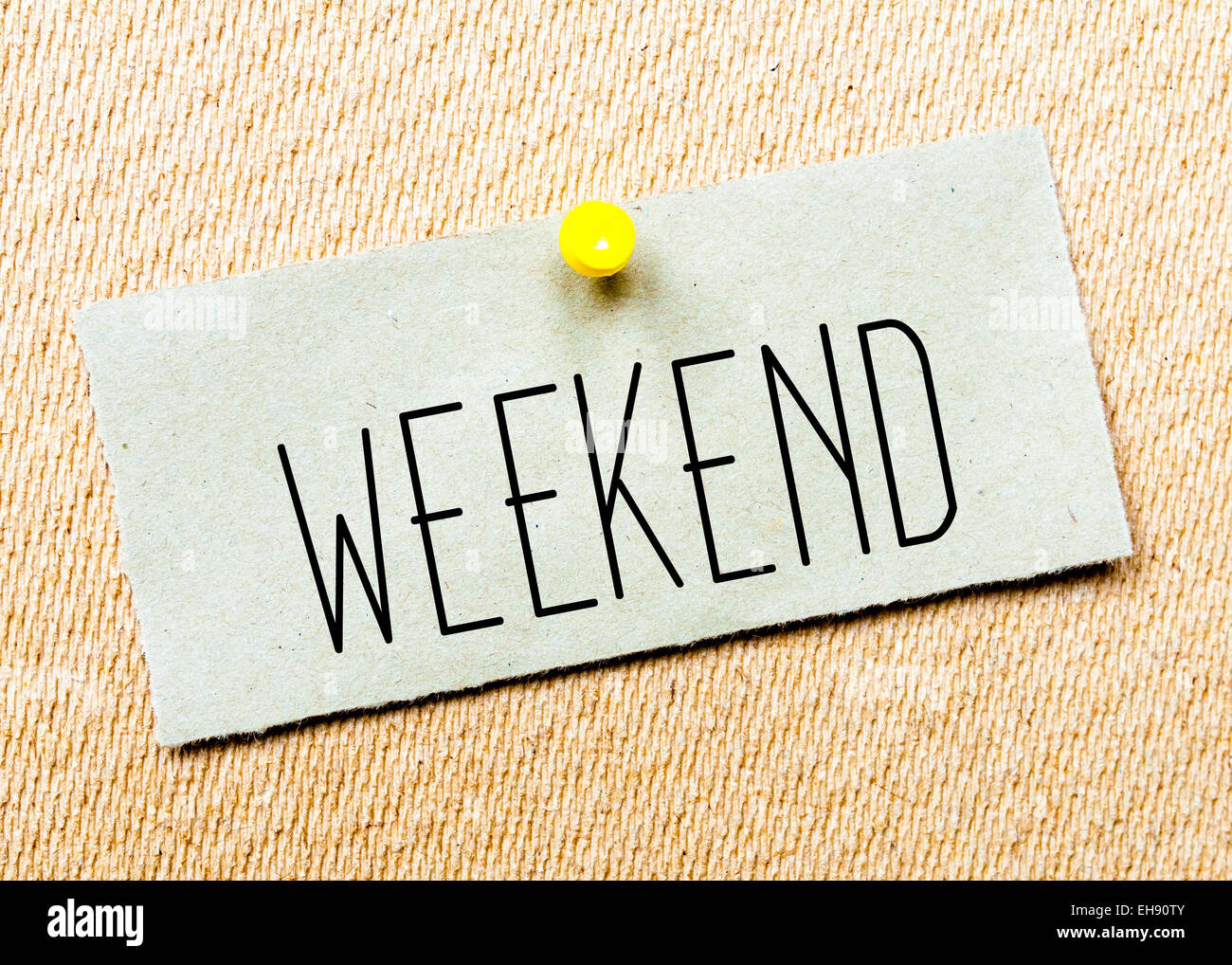 Recycled paper note pinned on cork board. Weekend Message. Concept ...