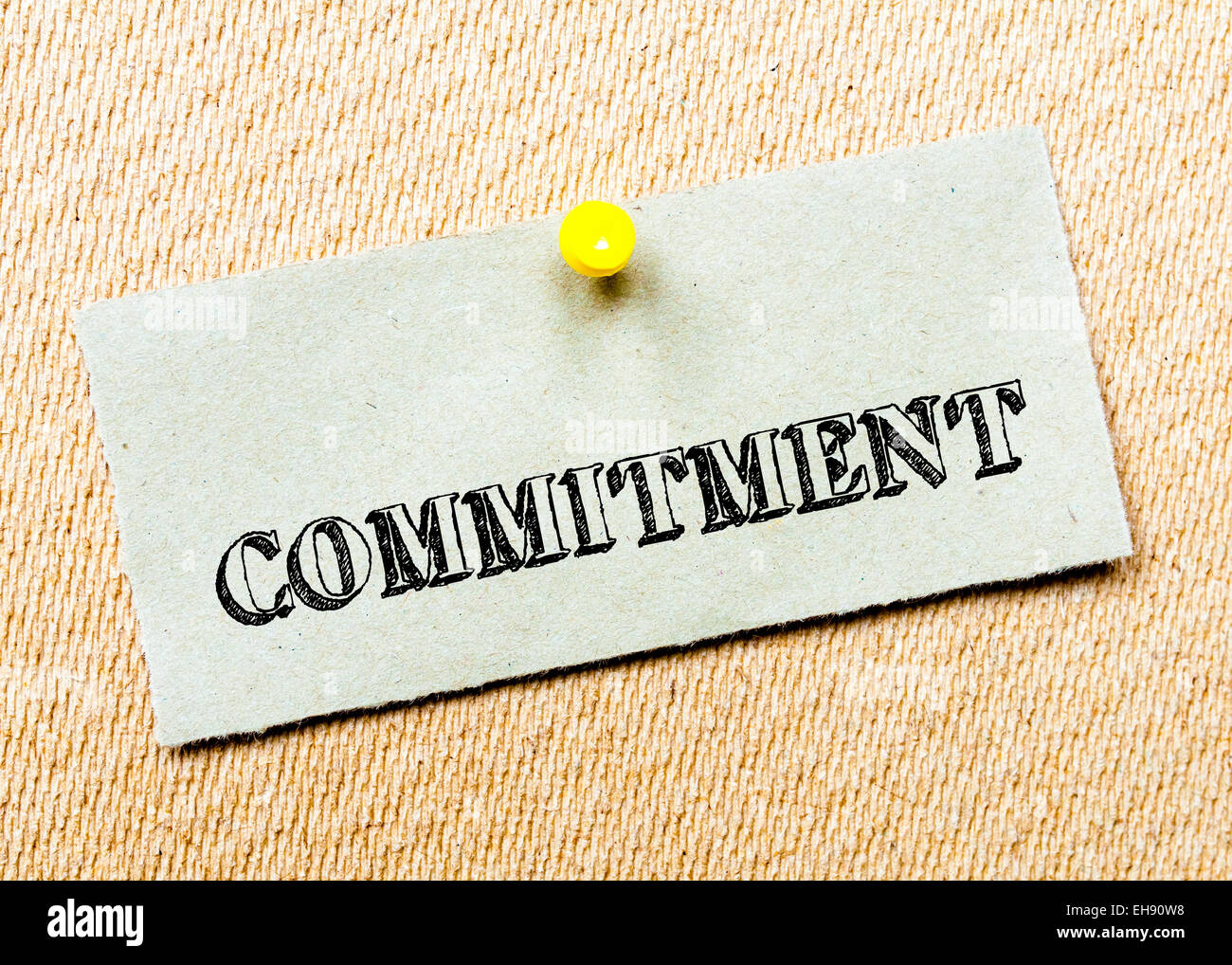 Recycled paper note pinned on cork board. Commitment Message. Concept ...