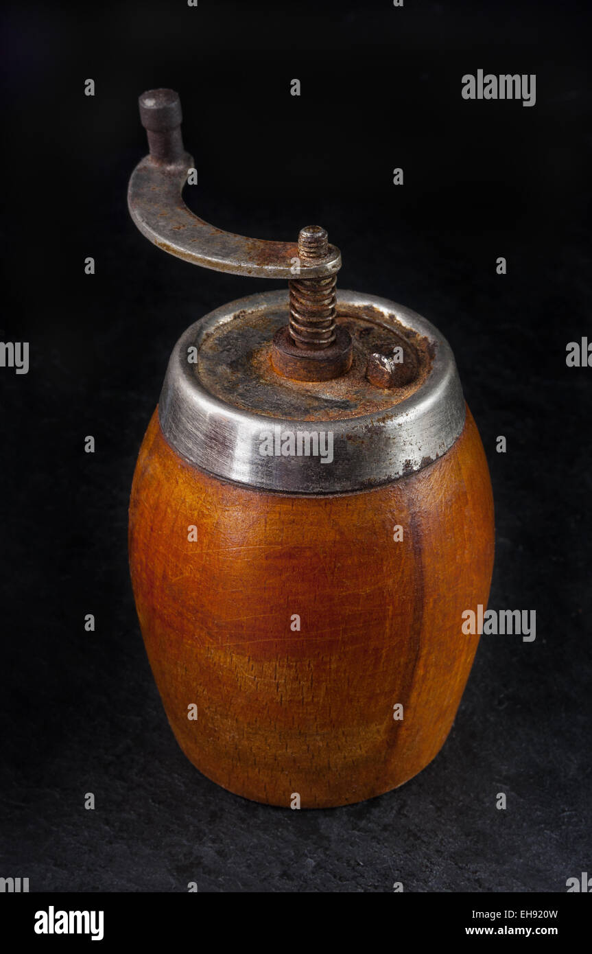 Vintage pepper mill on black stone table Stock Photo - Alamy