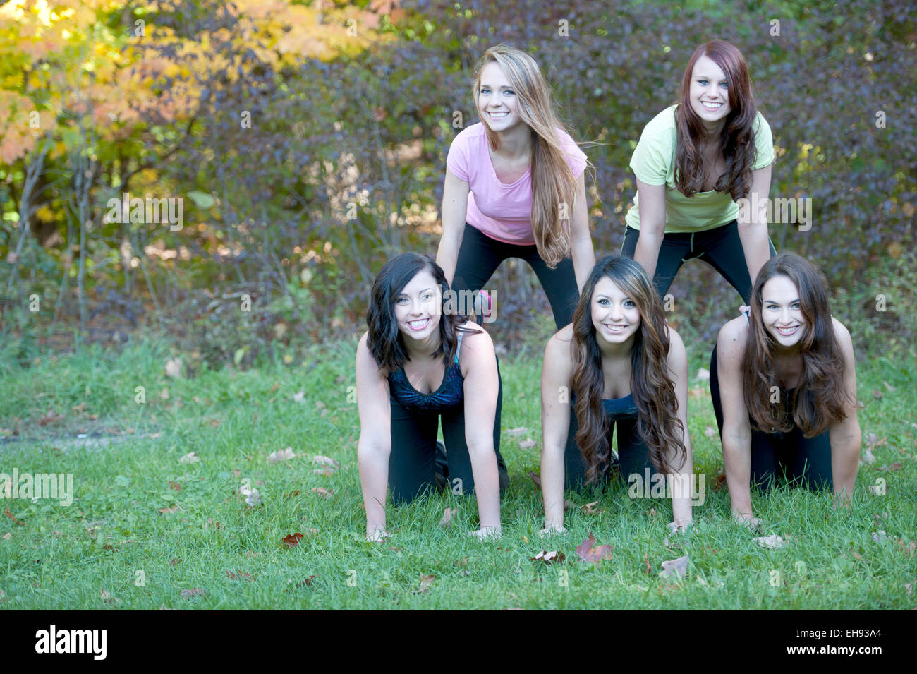 5 girls created a human pyramid on a sunny day outside Stock Photo - Alamy