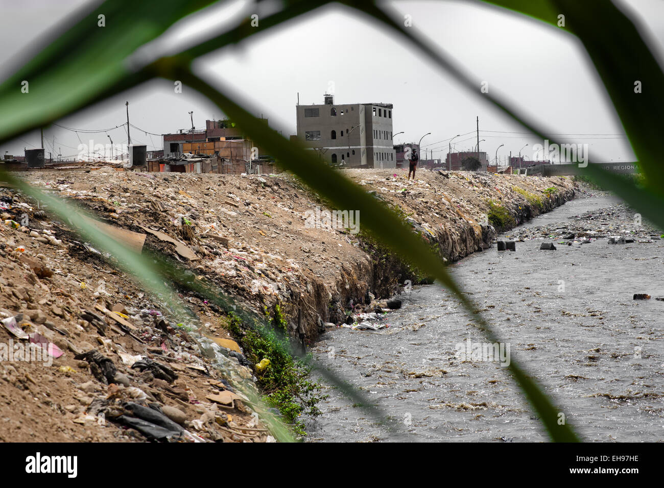 Waste and garbage are seen on the banks of Río Chillón, a heavily ...