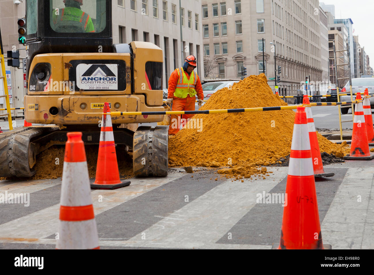 Municipal construction workers digging in city street - Washington, DC ...