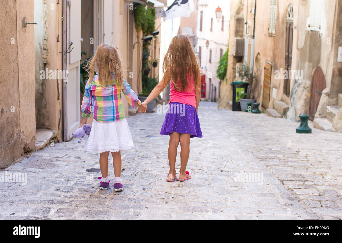 Adorable little girls outdoors in European city Stock Photo - Alamy