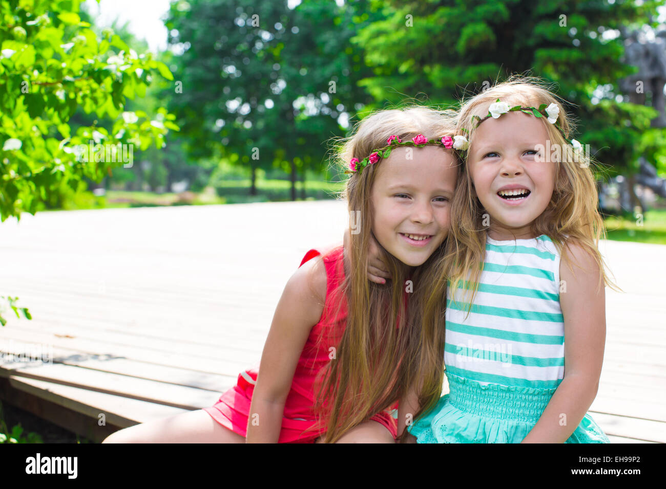 Happy adorable little girls enjoying warm summer day Stock Photo - Alamy