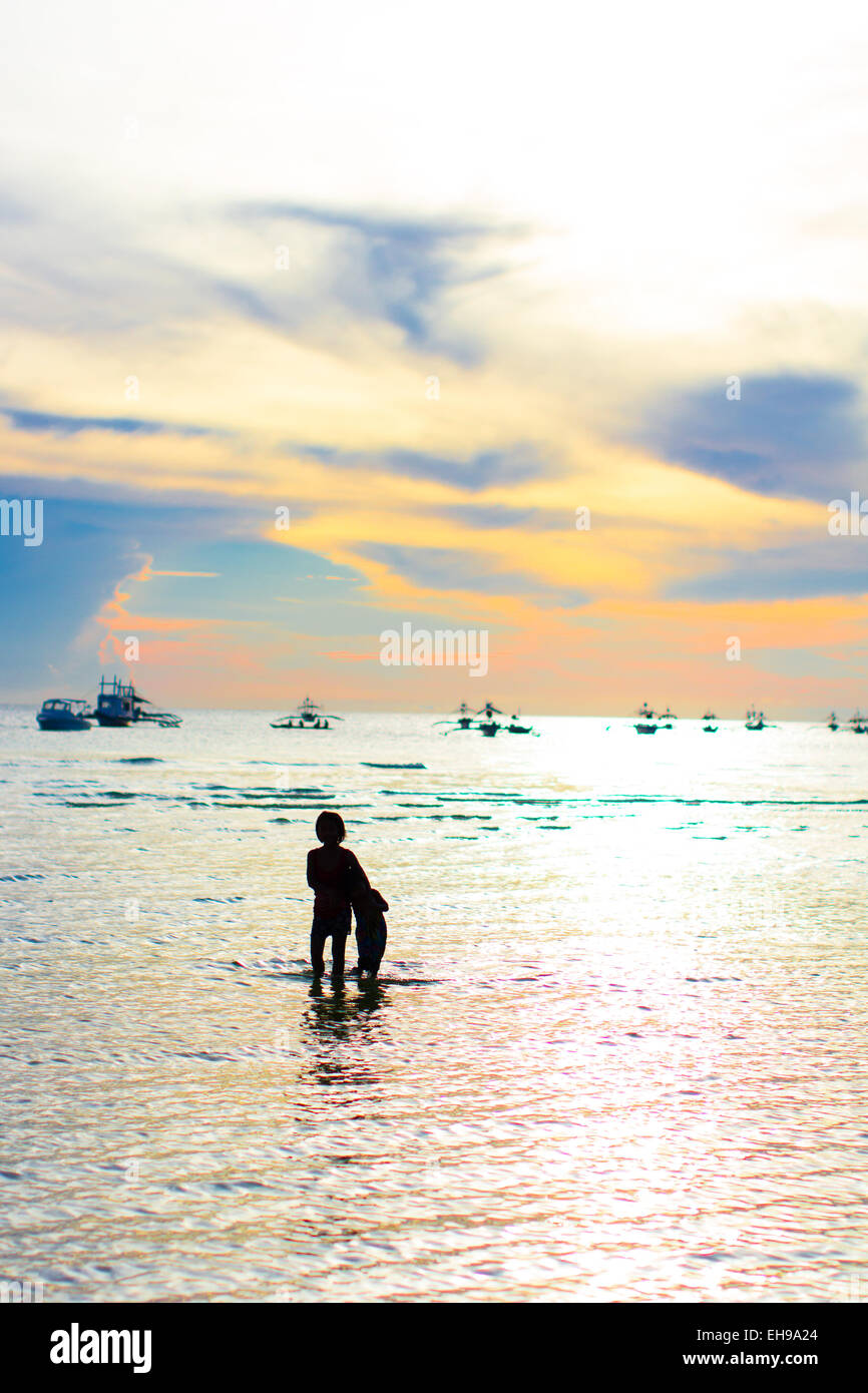Sailing boat and people at the sunset Stock Photo - Alamy