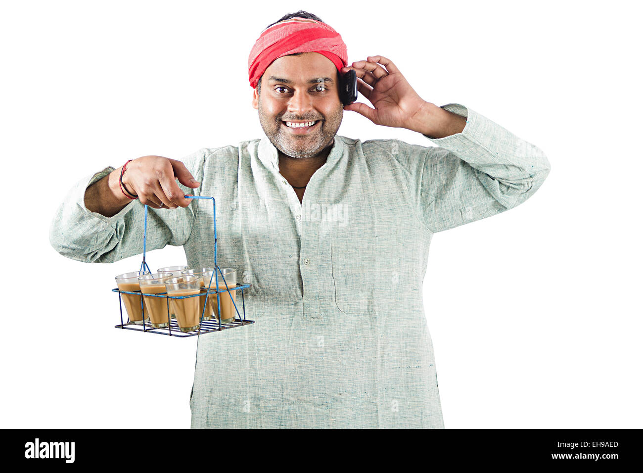 1 indian man Tea Servant Selling Tea and talking Mobile Phone Stock ...