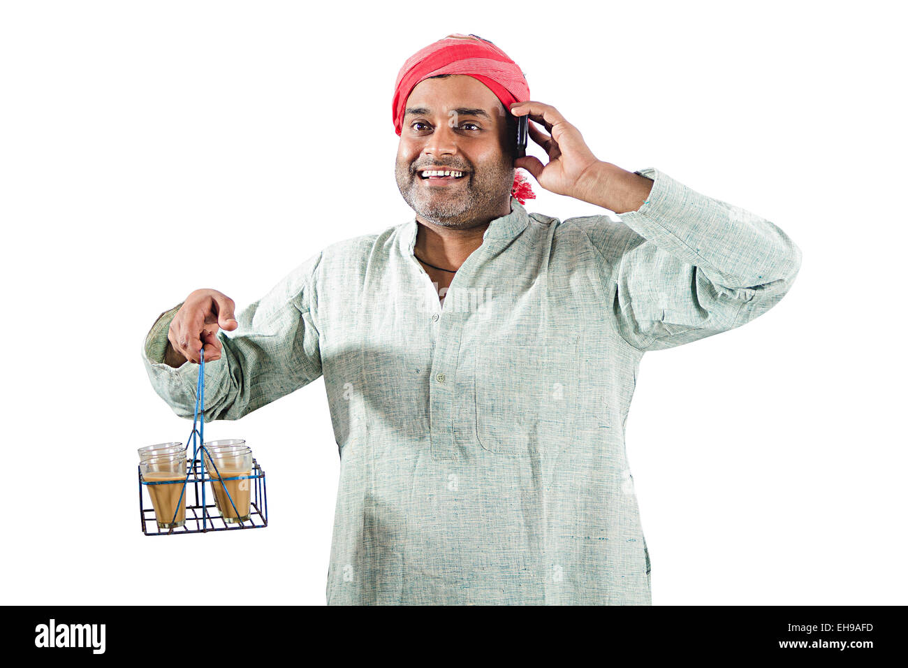 1 indian man Tea Servant Selling Tea and talking Mobile Phone Stock ...