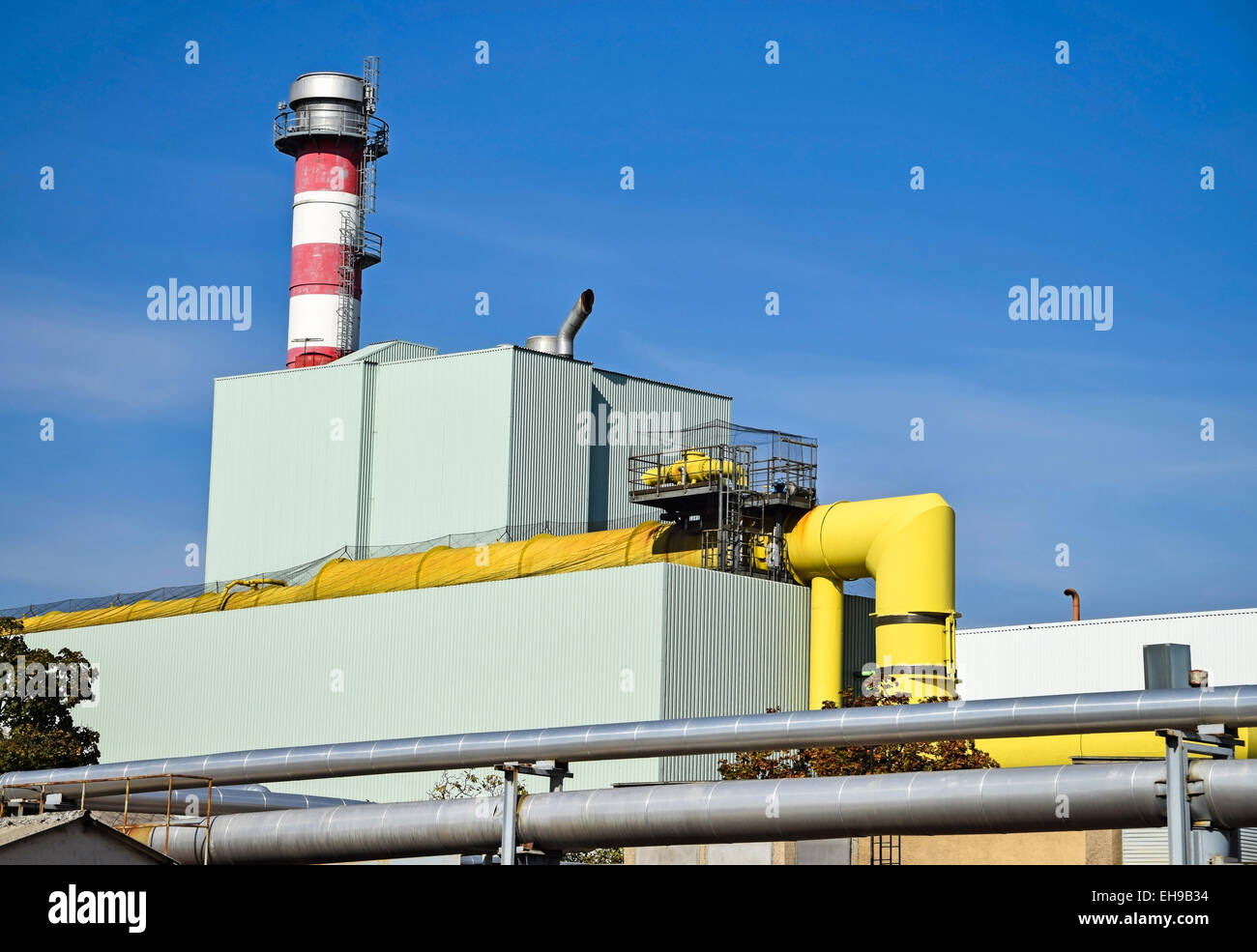 Building and smoke stack of the power station Stock Photo - Alamy
