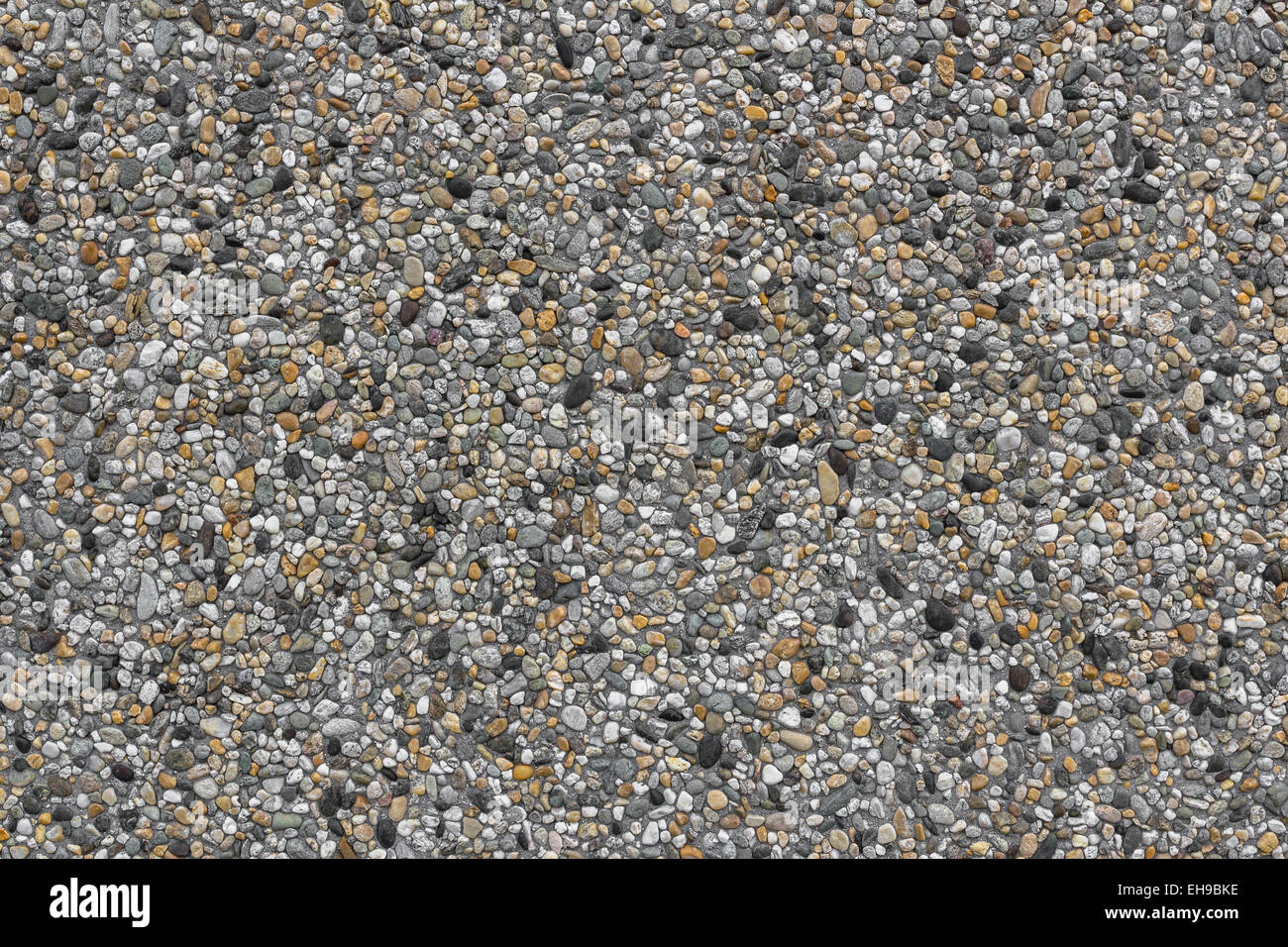 Details of a wall composed of small irregular stones Stock Photo - Alamy