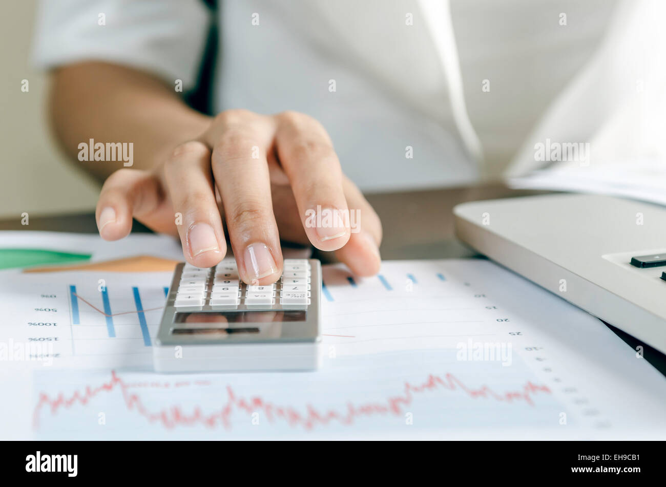 Working with calculator Stock Photo - Alamy