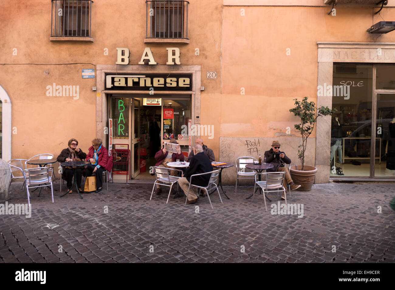 Traditional bar with clients, customers, people sitting and relaxing ...