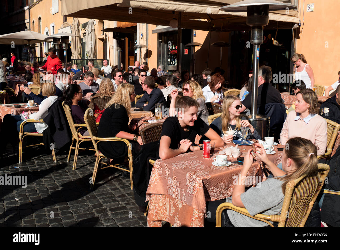 Restaurant, bar with clients, customers, people, tourists sitting and ...