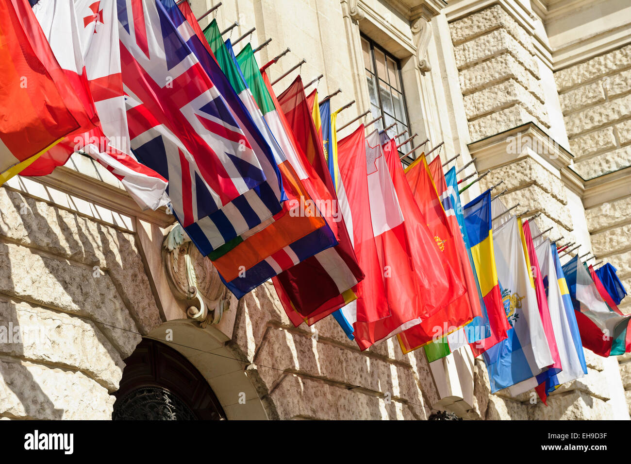 Multi National Flags handing outside Hofburg Palace wall, Vienna ...
