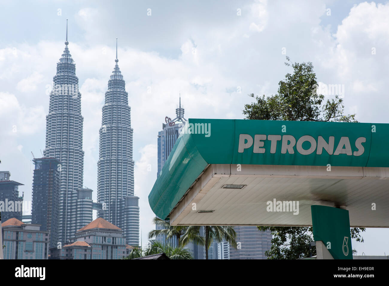 A Petroliam Nasional Bhd. (Petronas) gas station stands in front of the Petronas Twin Towers in ...