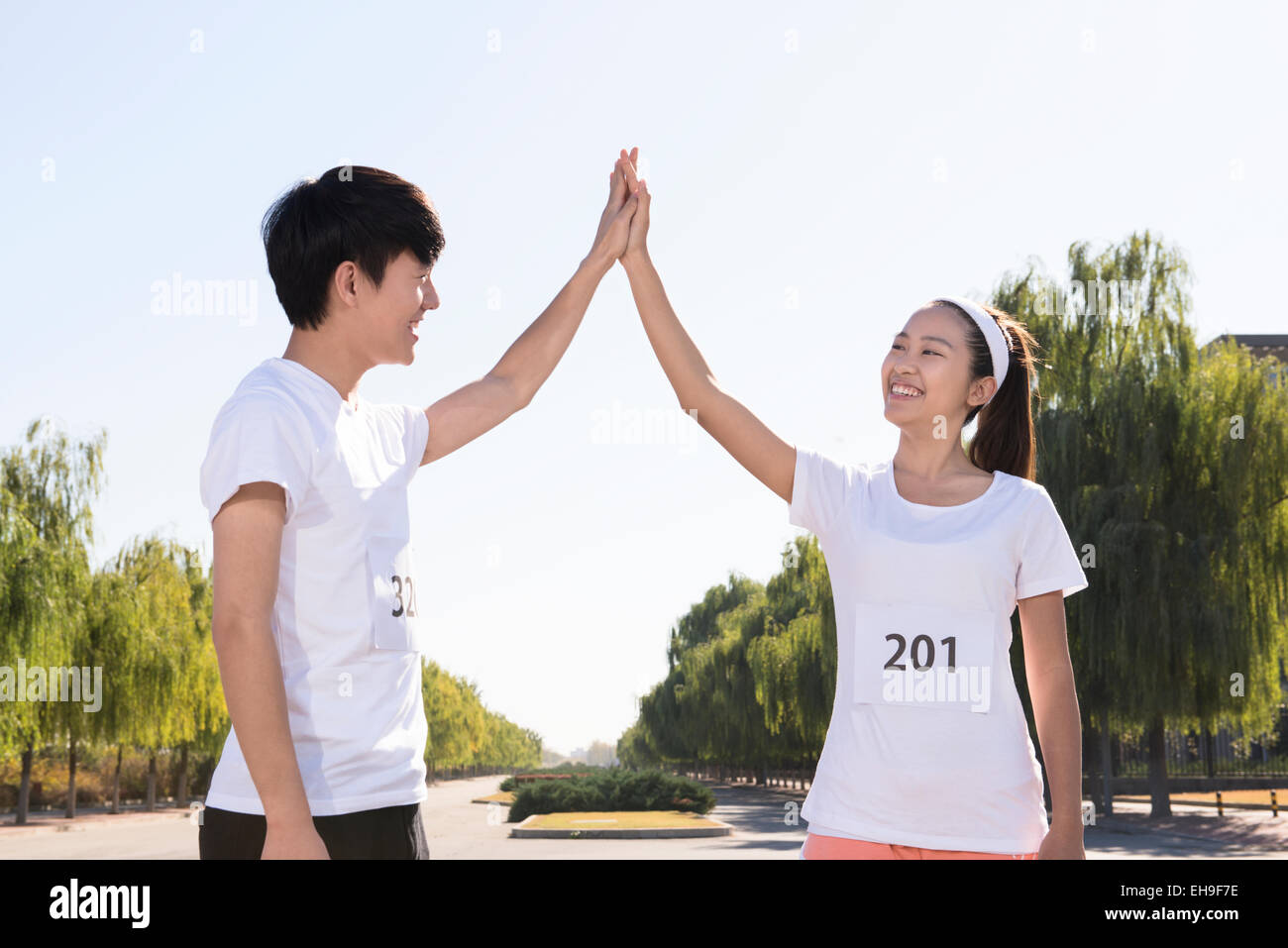 Marathon runners meet up Stock Photo - Alamy
