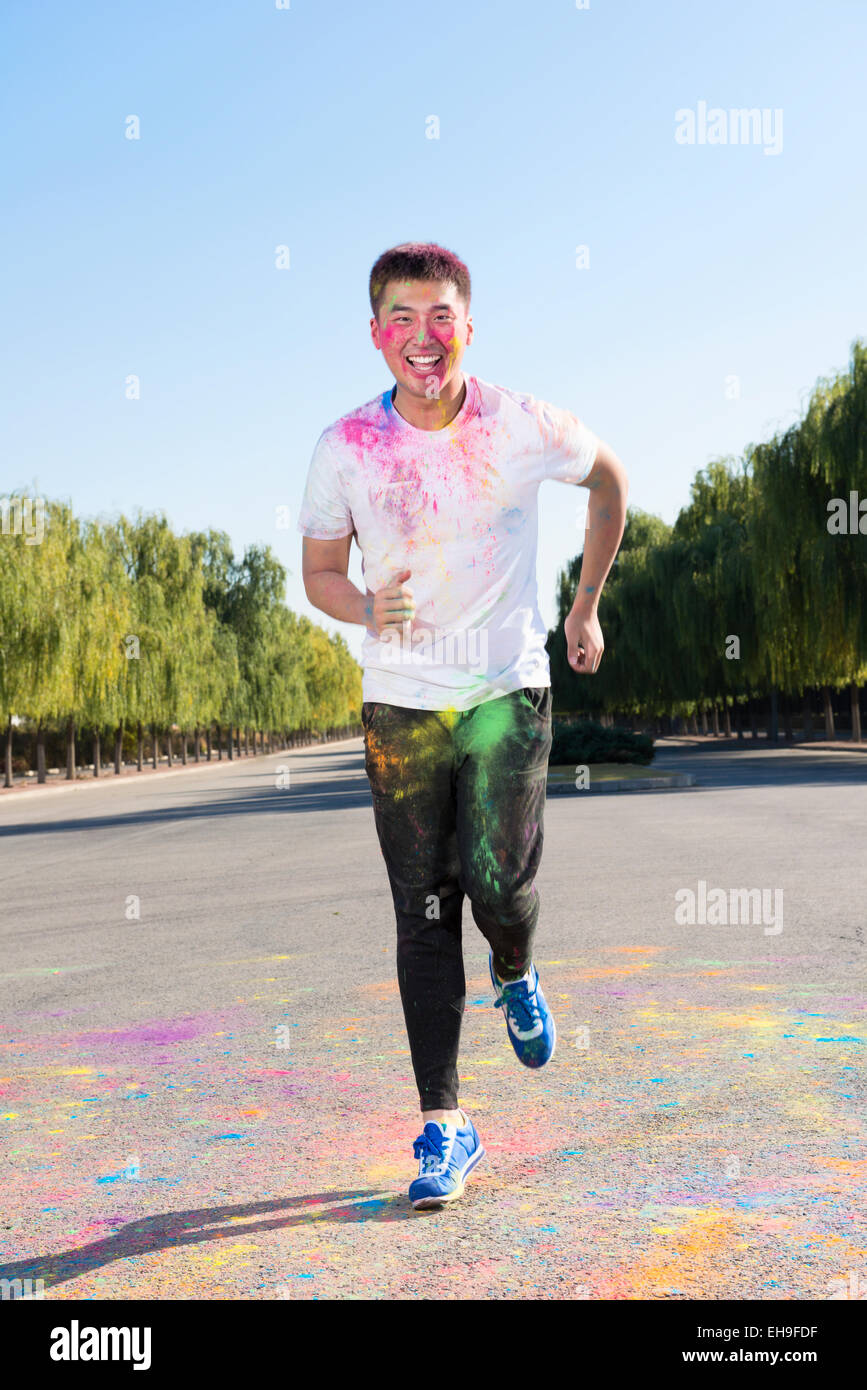 Young man at The Color Run Stock Photo - Alamy