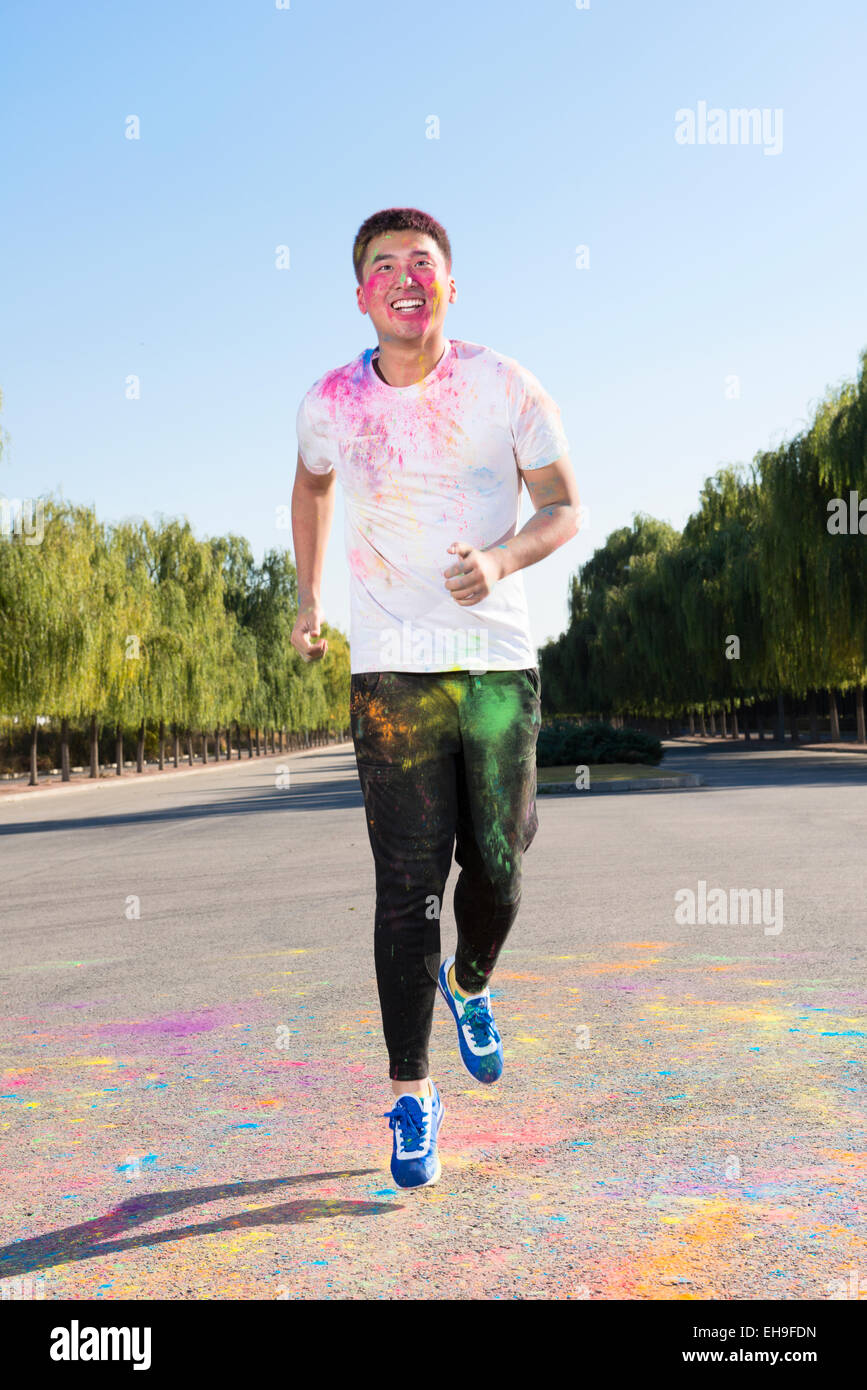 Young man at The Color Run Stock Photo - Alamy