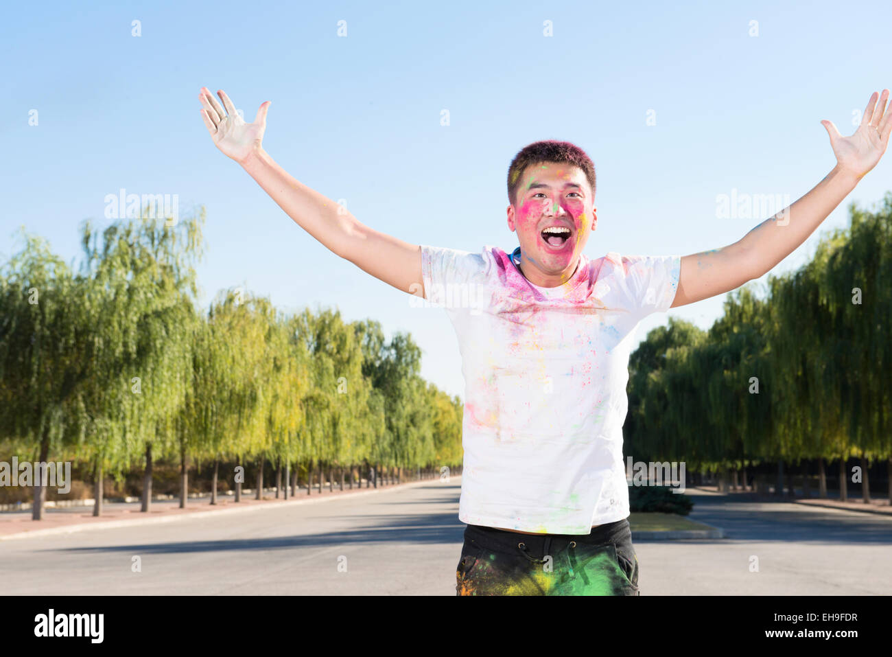 Young man at The Color Run Stock Photo - Alamy